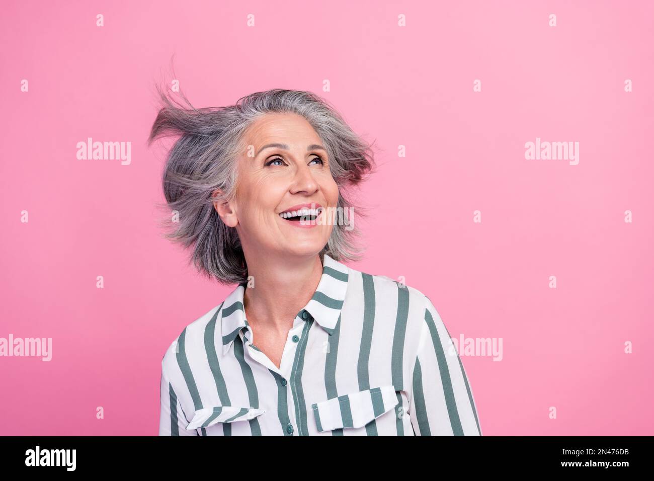 Photo of charming dreamy woman dressed smart casual outfit wind blowing ...