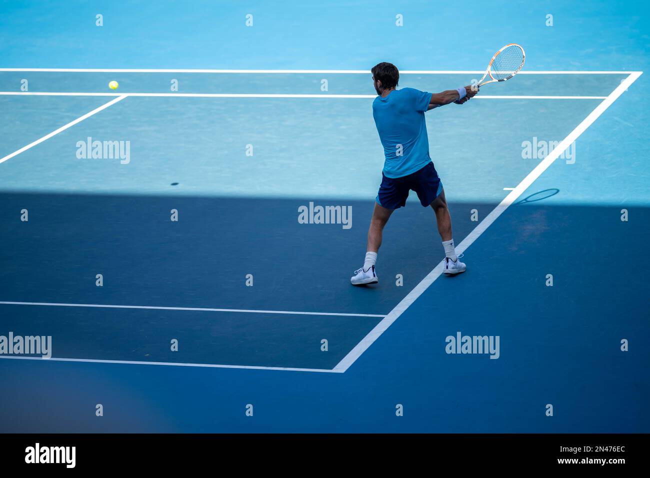 tennis fan watching a tennis match at the australian open eating food ...