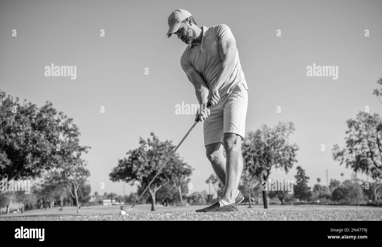 male golf player on professional golf course. portrait of golfer in cap ...