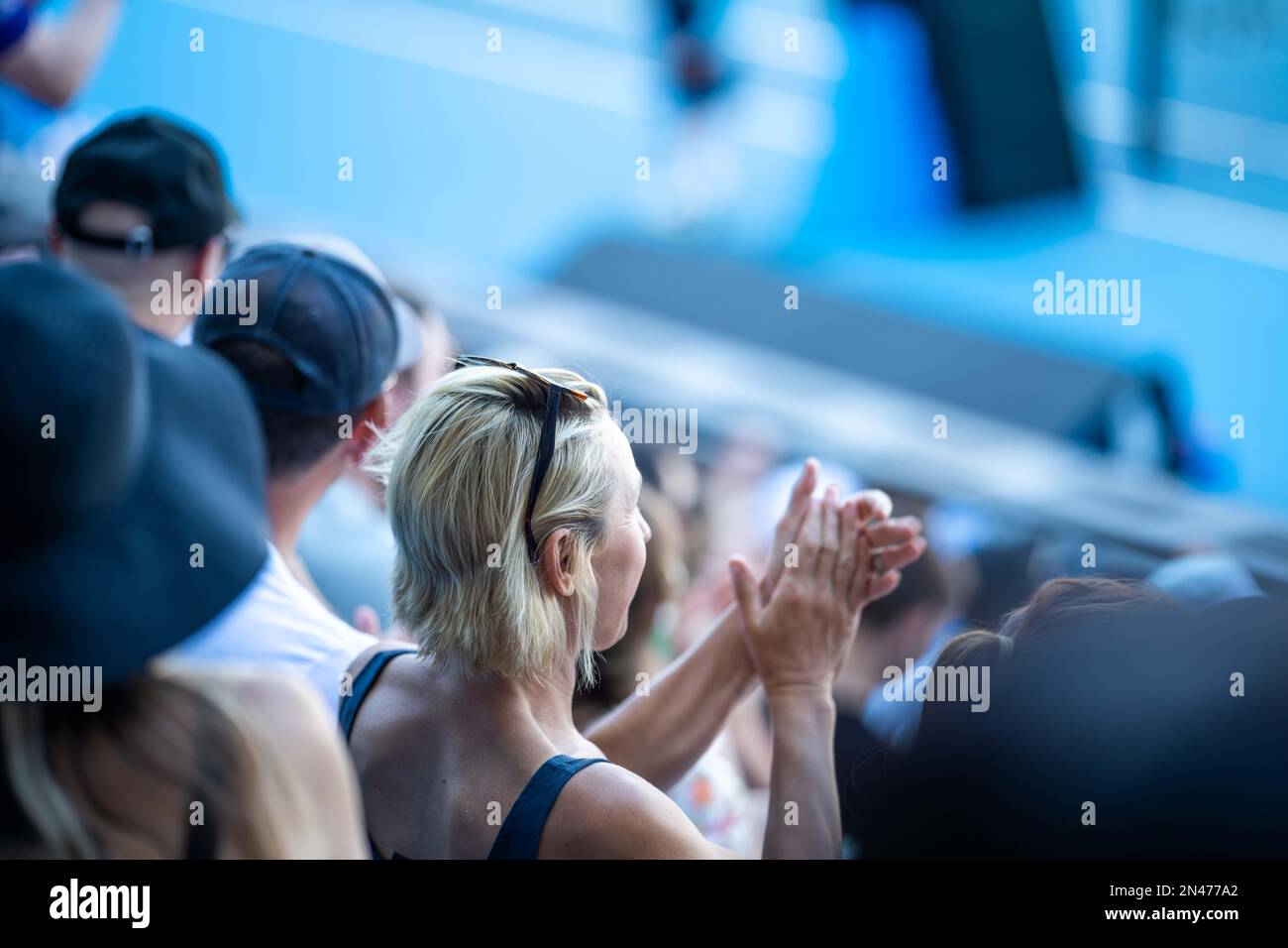 female Professional athlete Tennis player playing on a court in a ...
