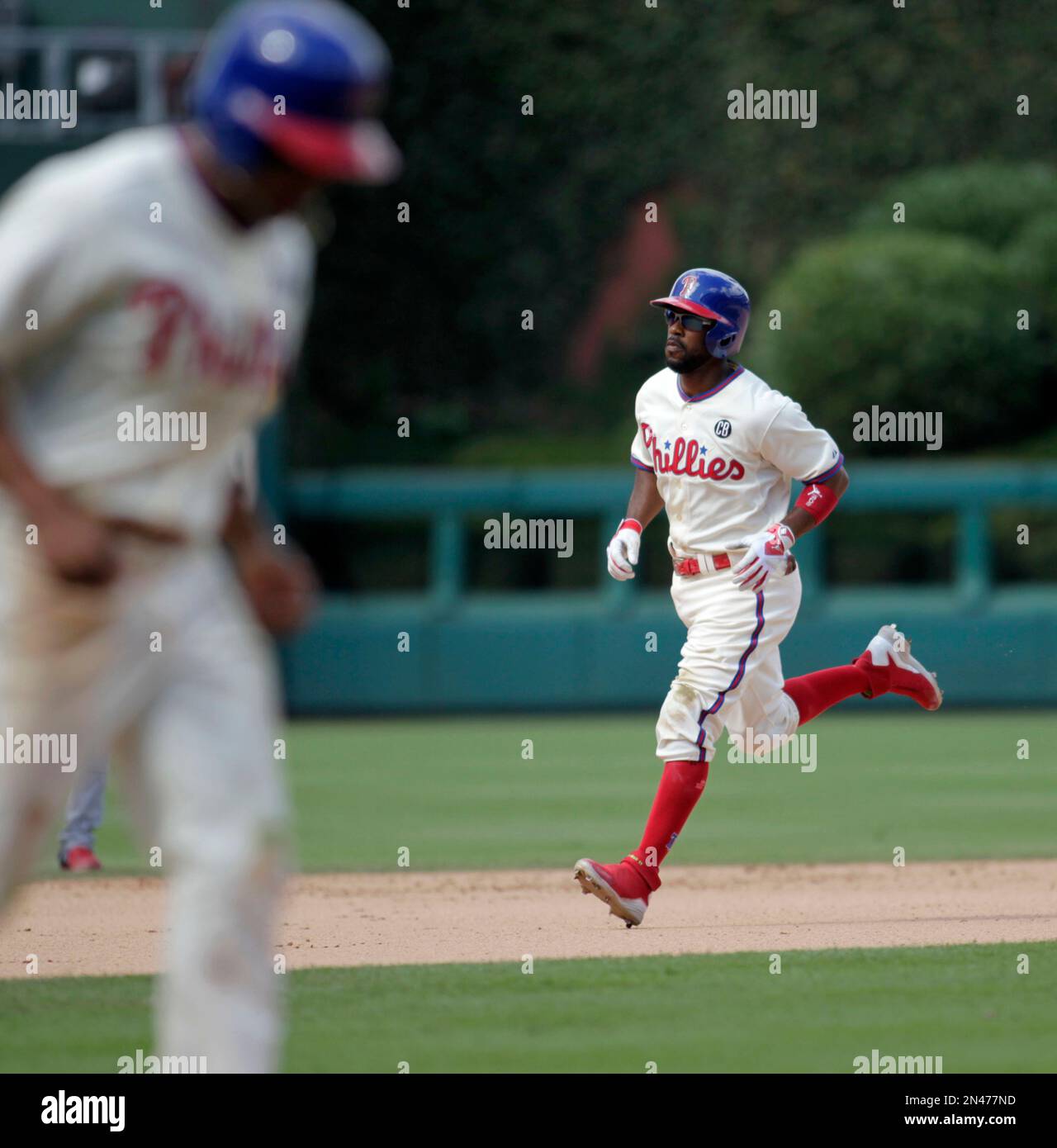 Philadelphia Phillies' Jimmy Rollins runs the bases after he hit a two ...