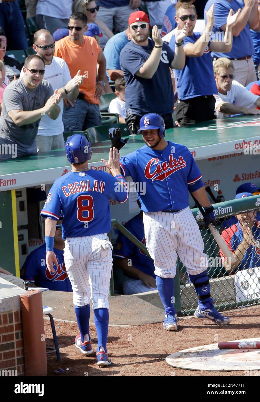 Chicago Cubs' Chris Coghlan, left, celebrates with Welington Castillo ...