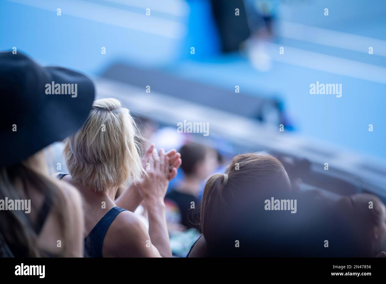 female Professional athlete Tennis player playing on a court in a ...