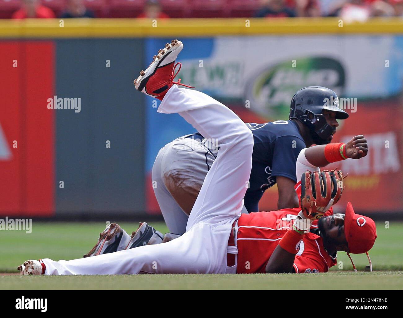 Cincinnati Reds second baseman Brandon Phillips (4) falls over Atlanta ...