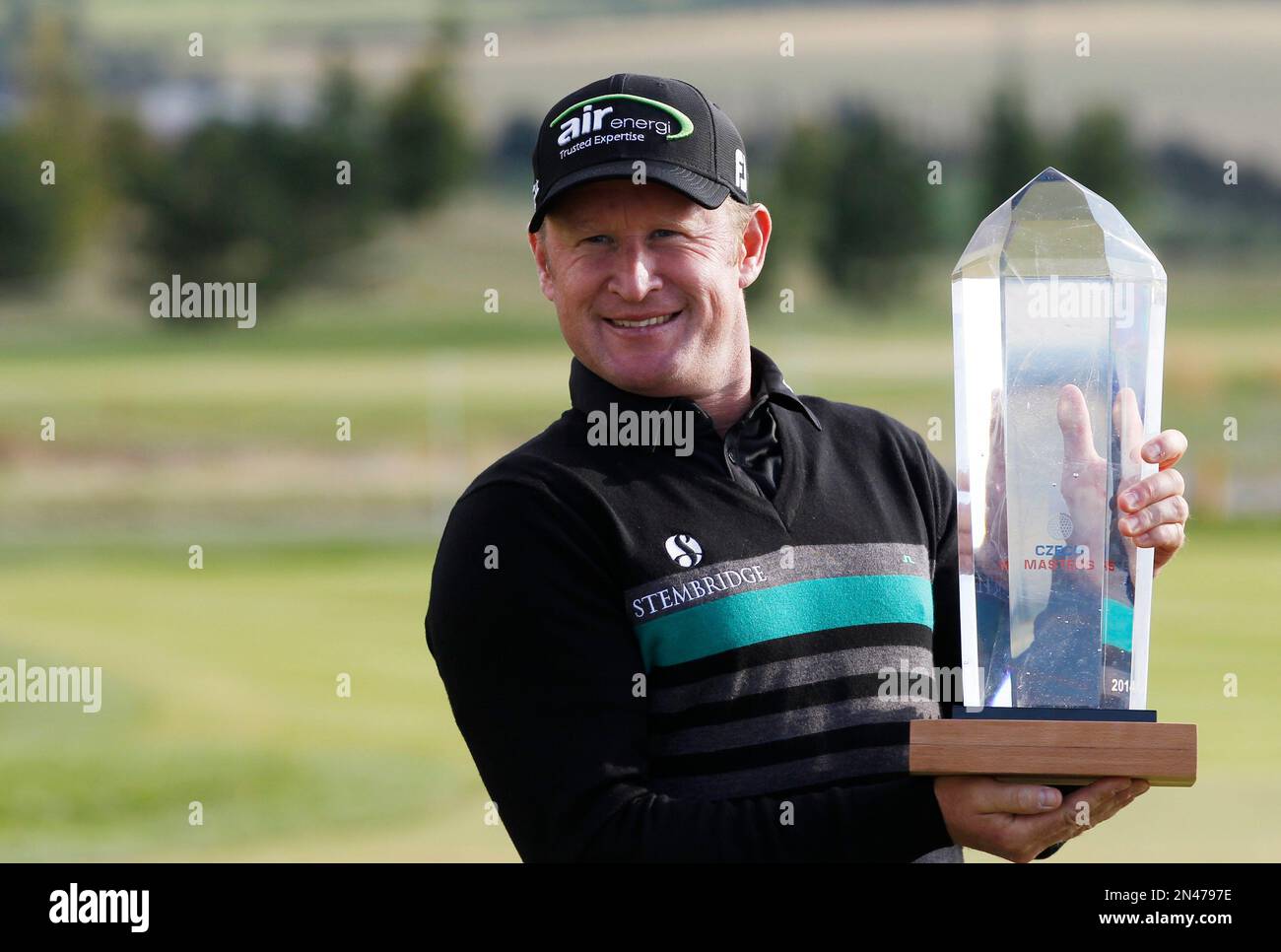 Jamie Donaldson from Wales poses with the trophy after winning the golf ...
