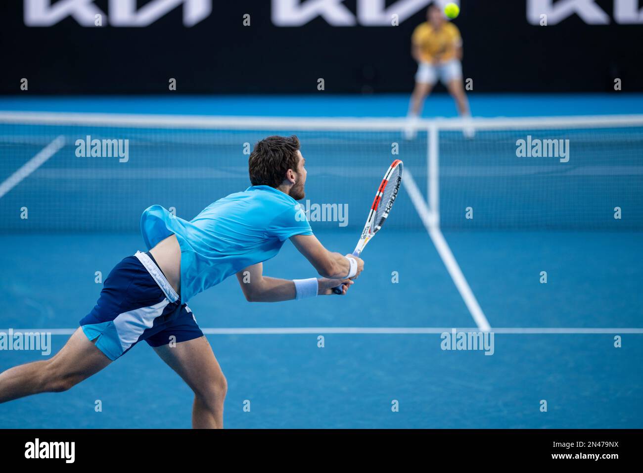 female Professional athlete Tennis player playing on a court in a ...