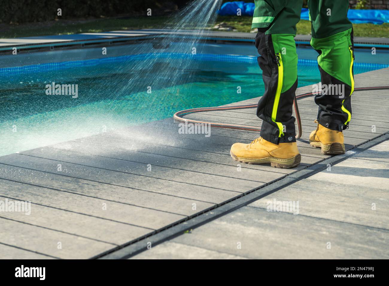 Outdoor Poolside Cleaning Using Garden Hose. Swimming Pool Composite ...