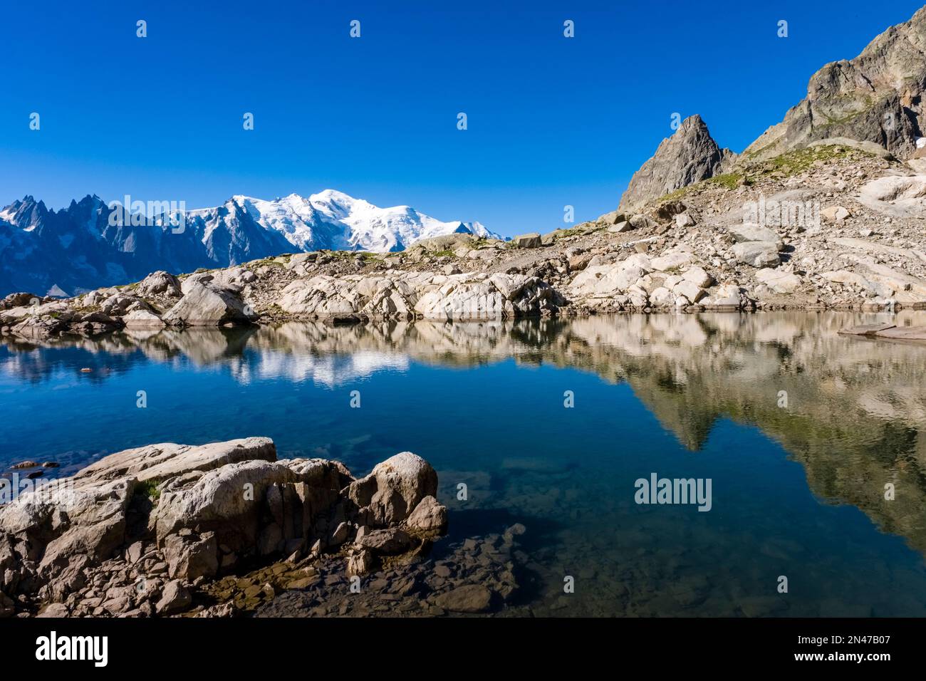 The peaks of the Mont Blanc massif are reflecting on the surface of Lac Blanc Stock Photo - Alamy