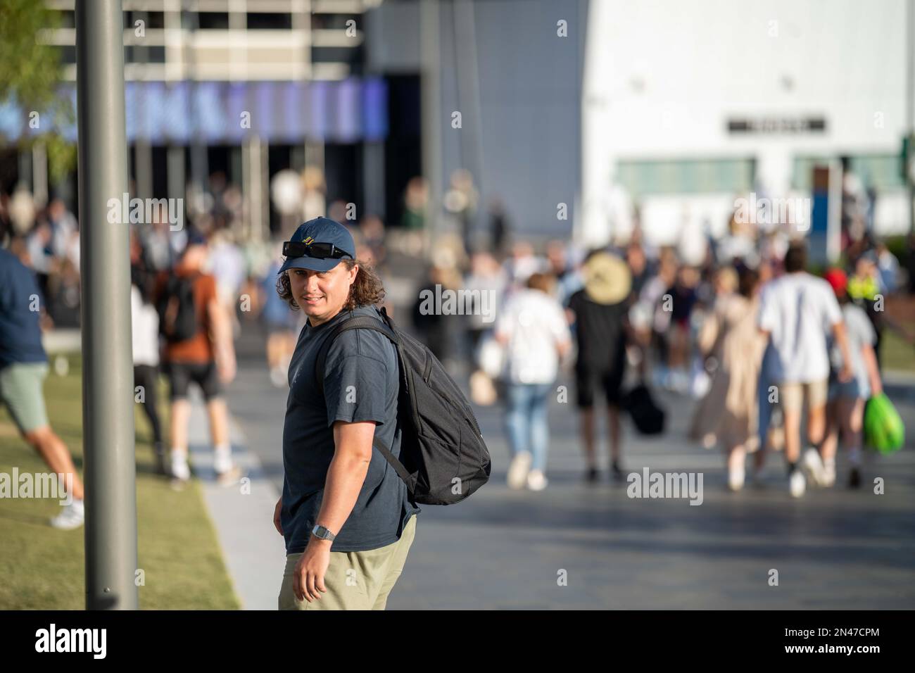 tennis fan watching a tennis match at the australian open eating food ...