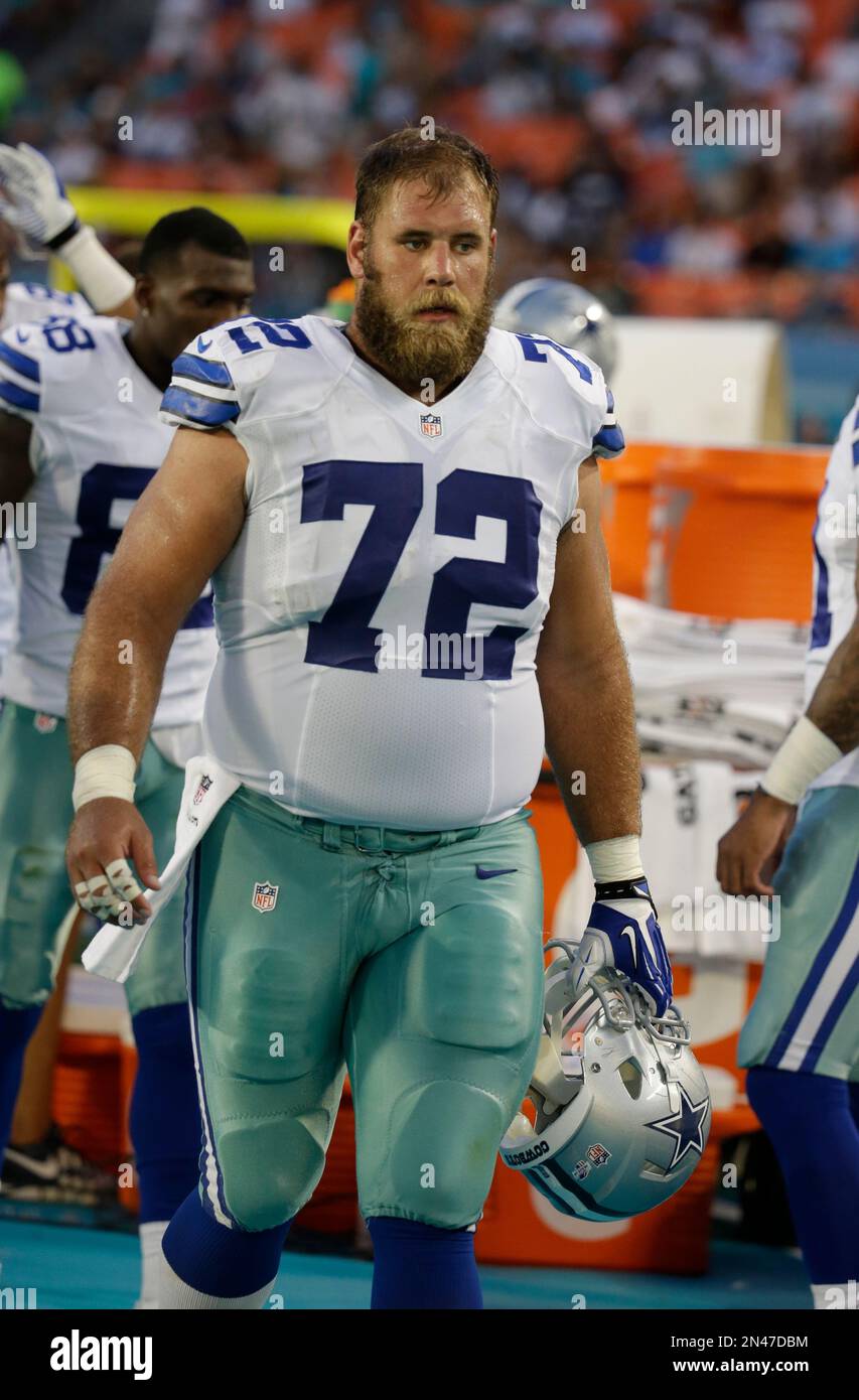 Dallas Cowboys center Travis Frederick (72) walks the sidelines during ...