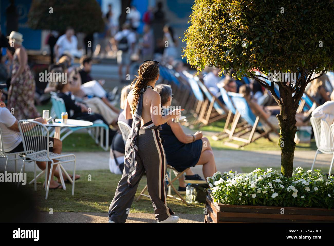 female Professional athlete Tennis player playing on a court in a ...