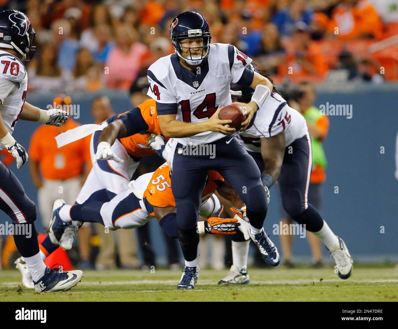 Houston Texans quarterback Ryan Fitzpatrick (14) escapes the reach of ...