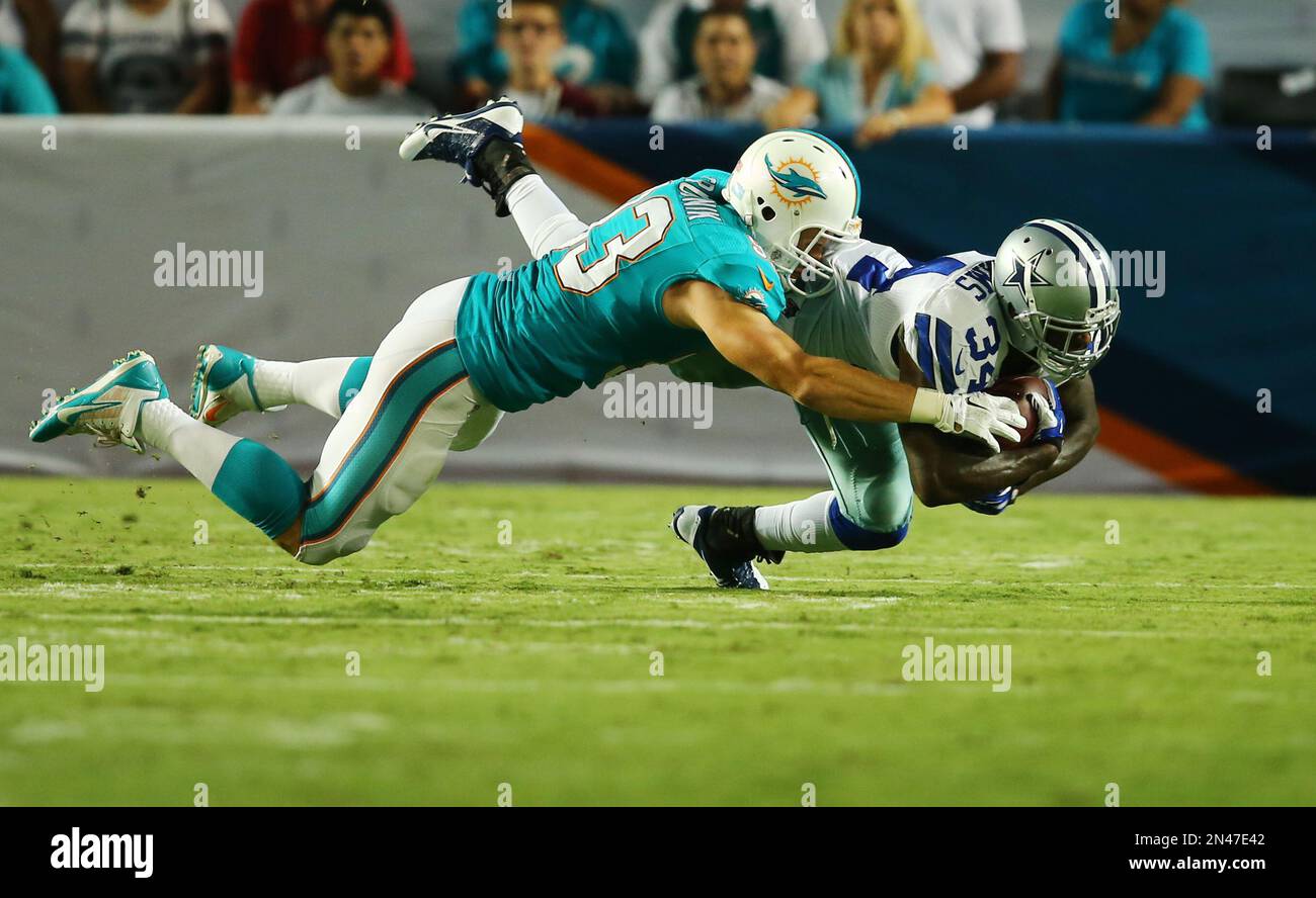 Dallas Cowboys running back Ryan Williams (34) is tackled by Miami ...
