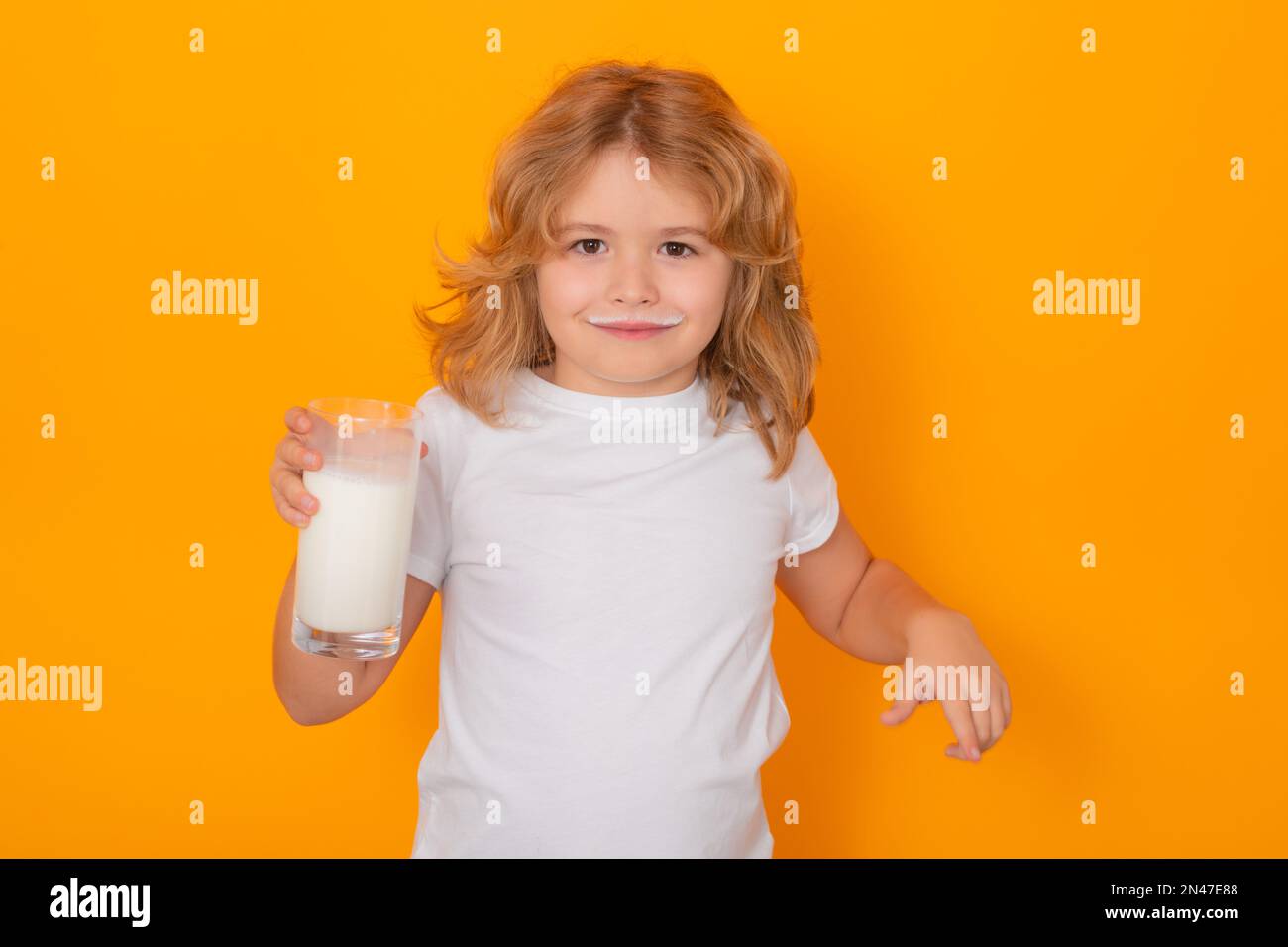 Healthy drink with calcium and protein for kids. Child with a glass of ...