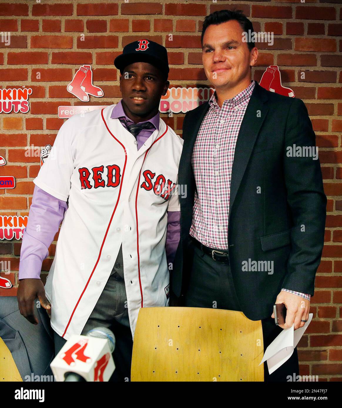 Boston Red Sox general manager Ben Cherington, right, poses with Rusney ...