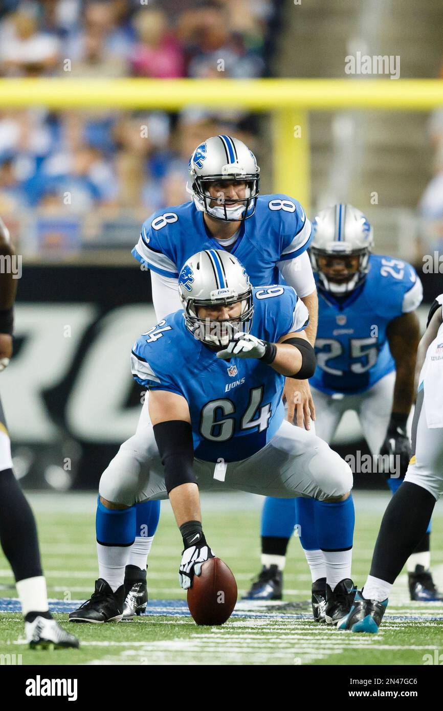 Detroit Lions center Travis Swanson (64) gets set tohick the ball to ...