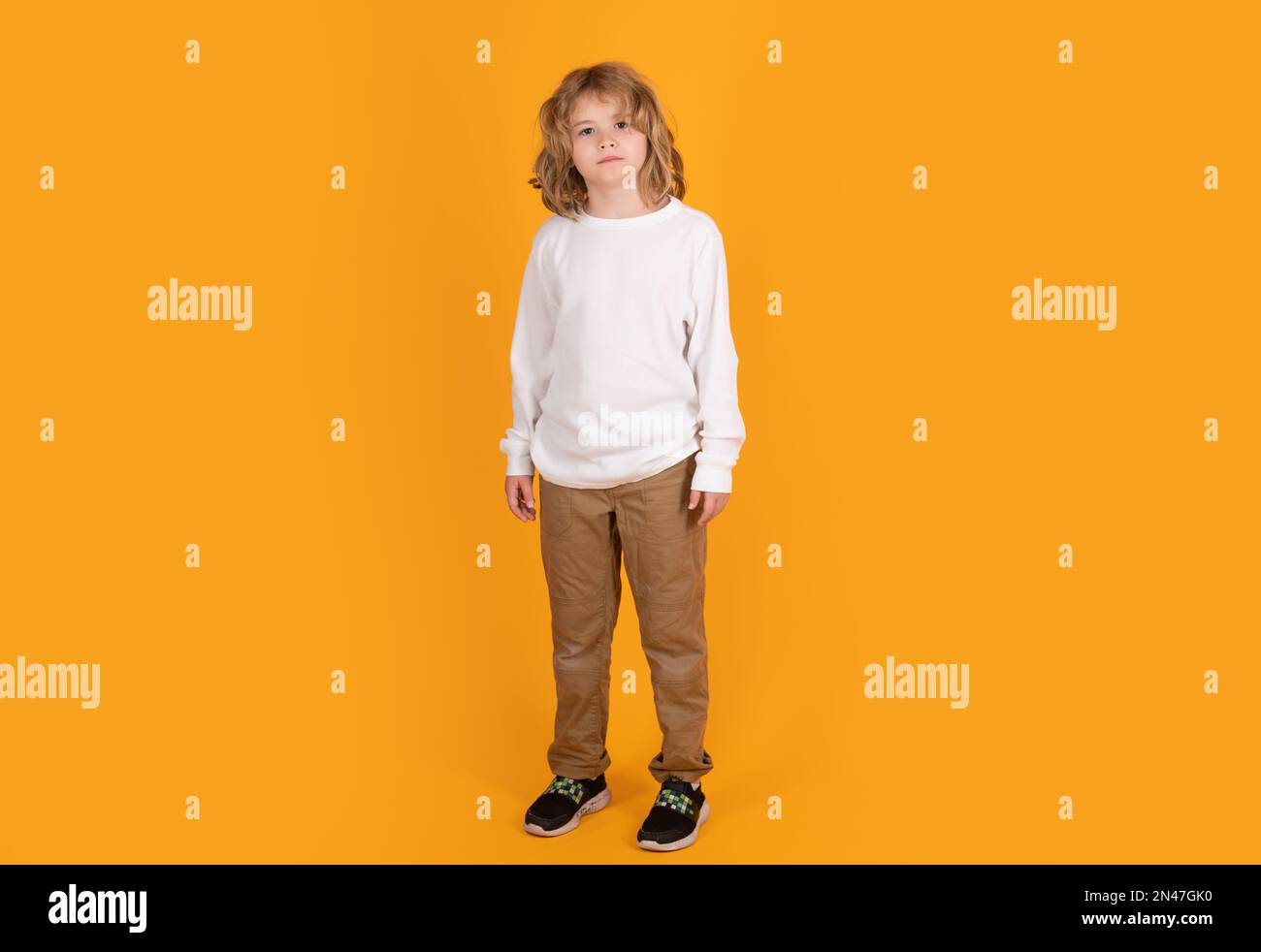 Full size photo of school kid isolated on yellow background Stock Photo ...