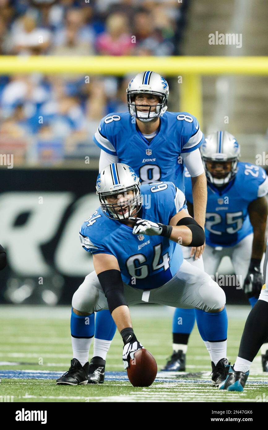 Detroit Lions center Travis Swanson (64) gets set tohick the ball to ...