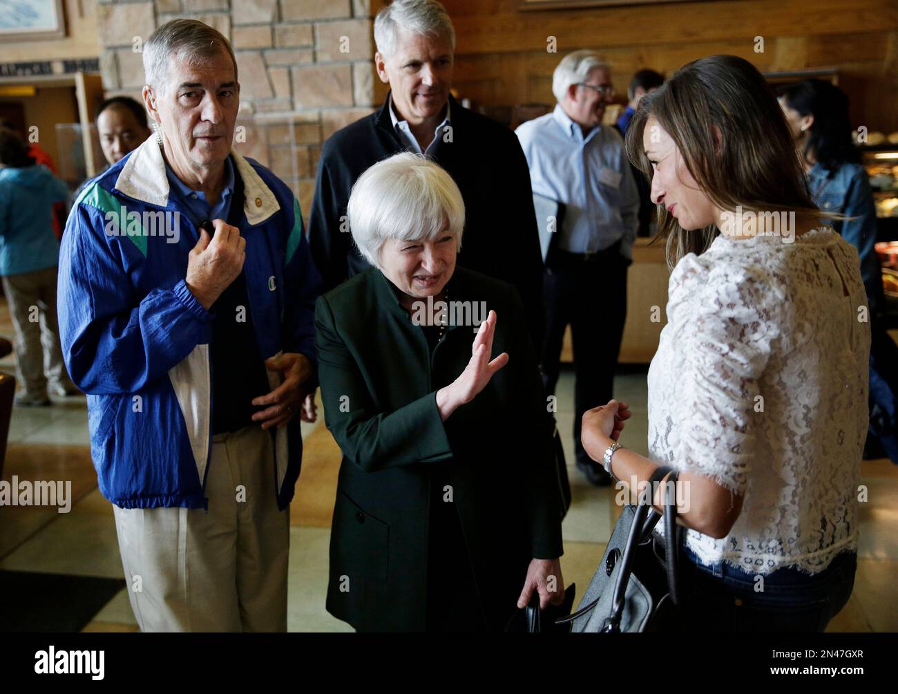 Federal Reserve Chair Janet Yellen, center, meets Heather Loomis, right ...