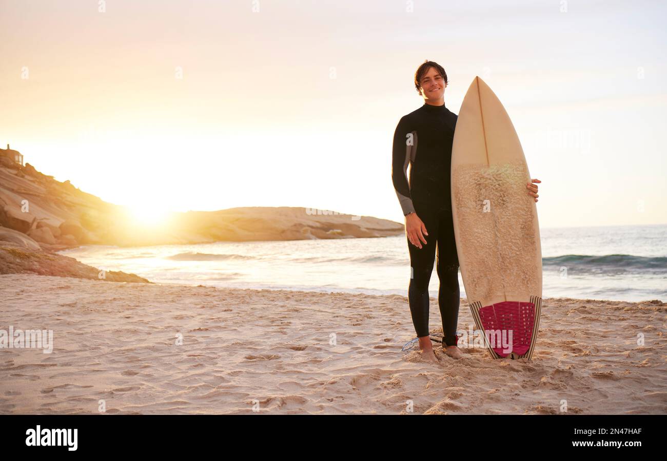 Surfer, portrait and man with surfboard at the sea, beach and ocean in ...