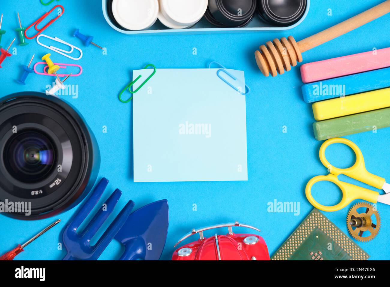 Blue paper sticker blue background in center of a variety things for ...