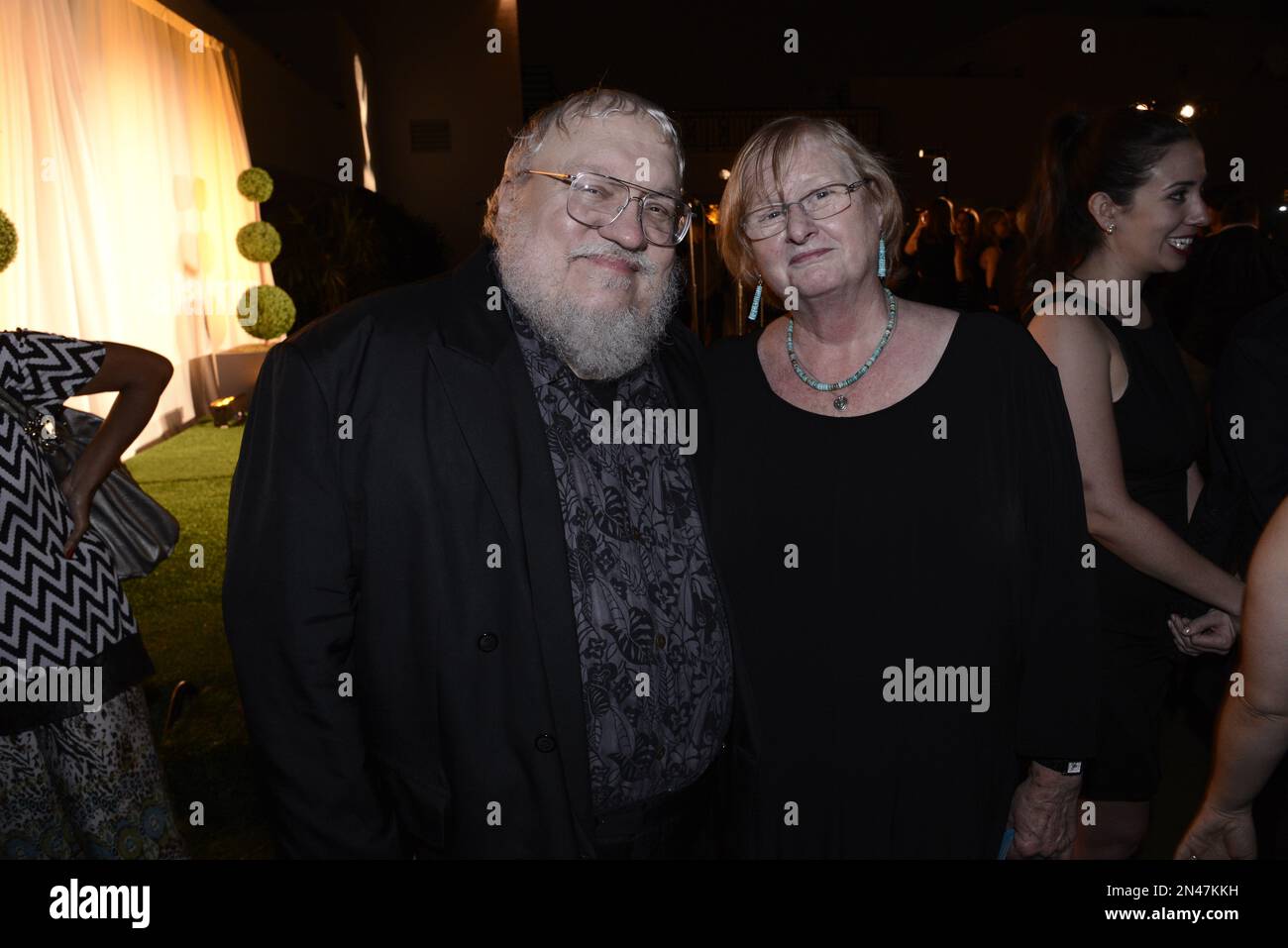 George R.R. Martin, left, and Parris McBride attend at the Television ...