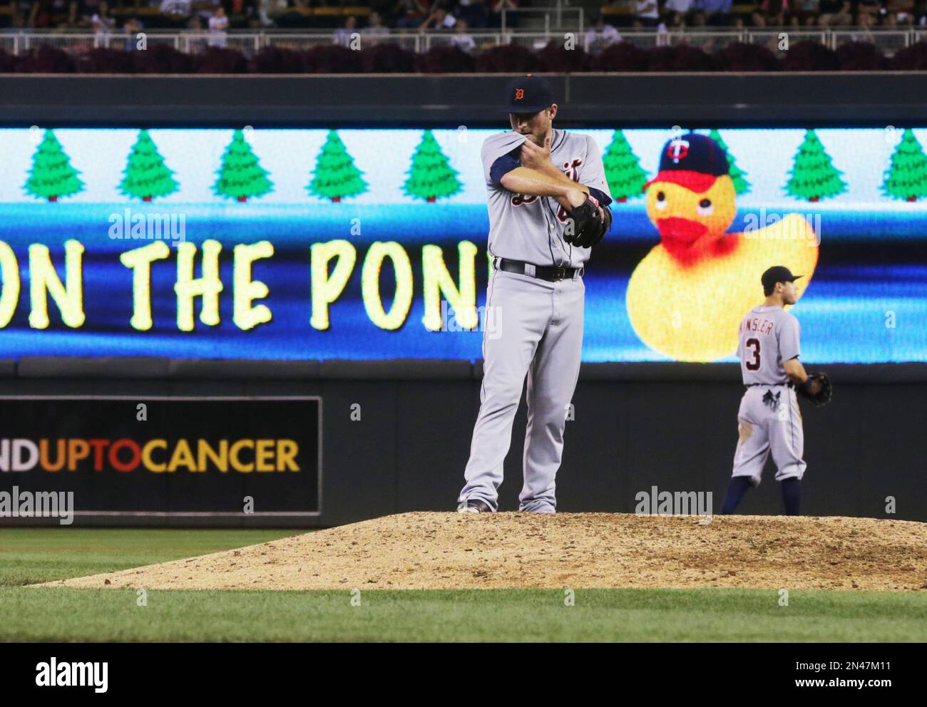 Detroit Tigers pitcher Ian Krol wipes his face after giving up a walk ...