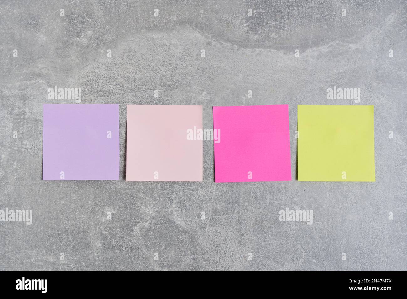 Colorful stickers for writing notes are glued concrete wall Stock Photo ...