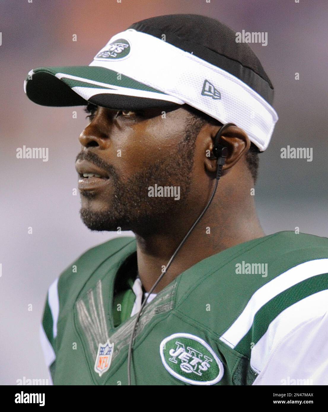 New York Jets quarterback Michael Vick (1) watches from the sidelines ...