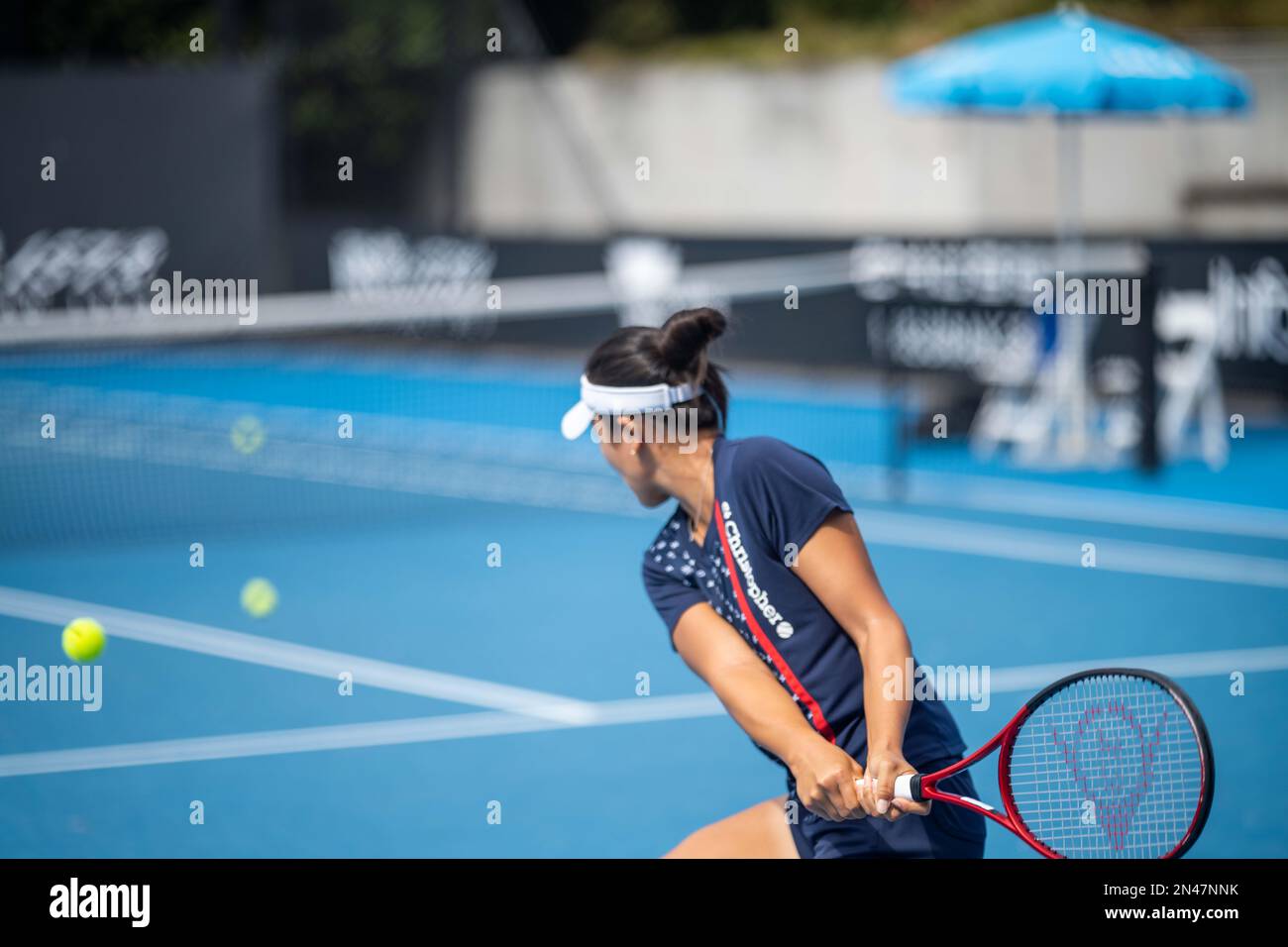 Beautiful female athlete playing tennis. Amateur female tennis player ...