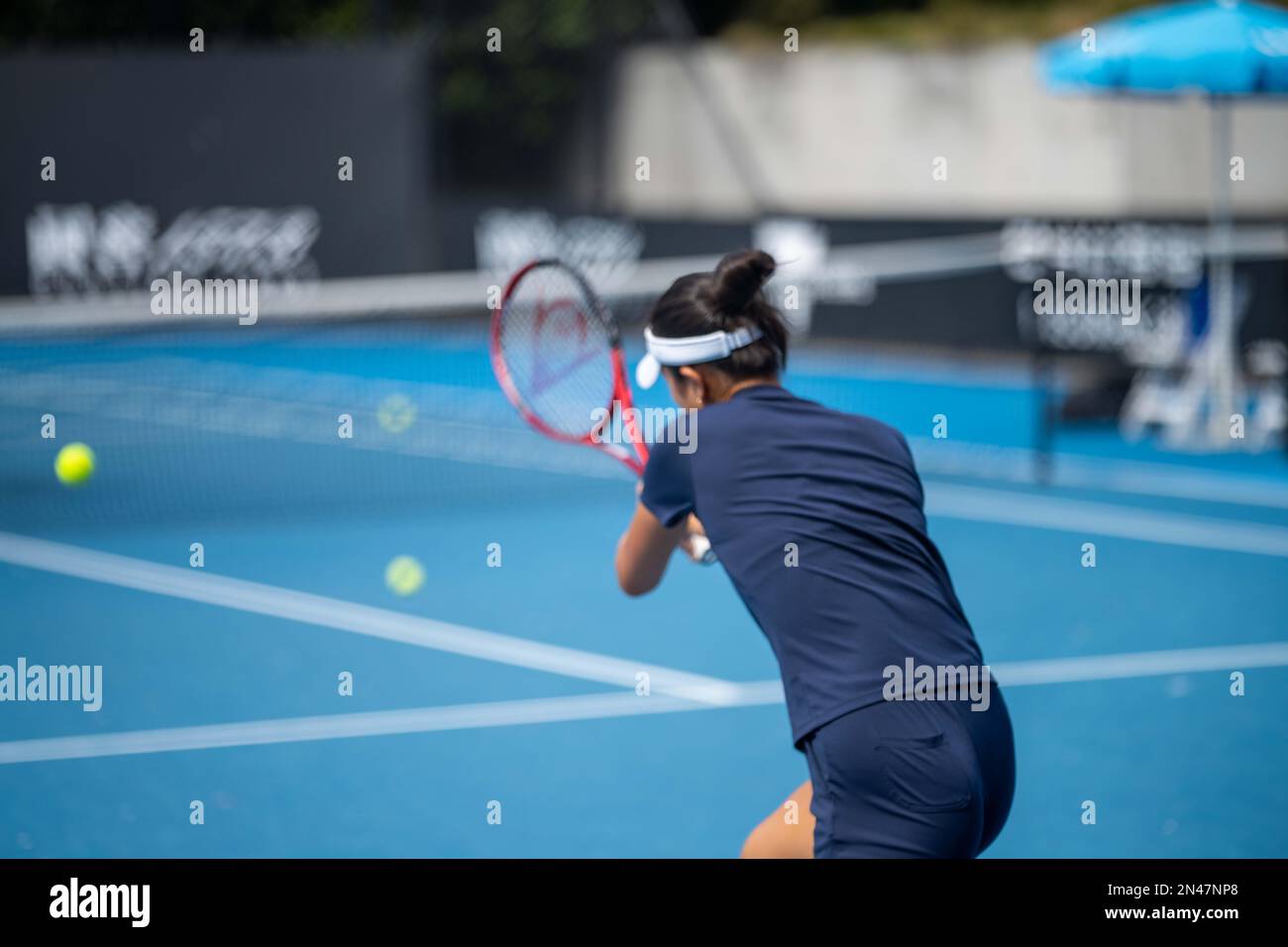 Beautiful female athlete playing tennis. Amateur female tennis player ...