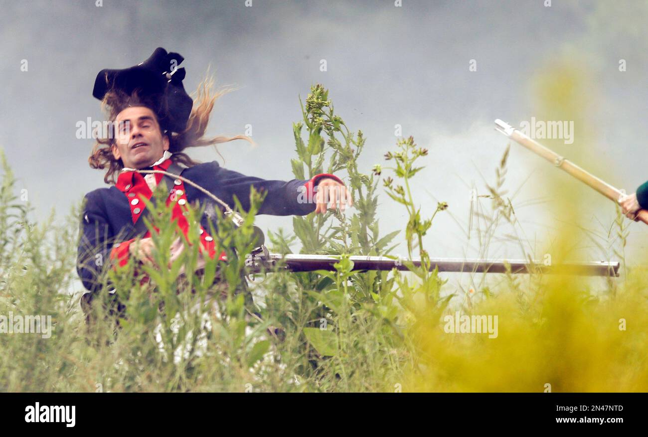 Actor Matt Vincent falls from a gunshot during battle while filming an ...