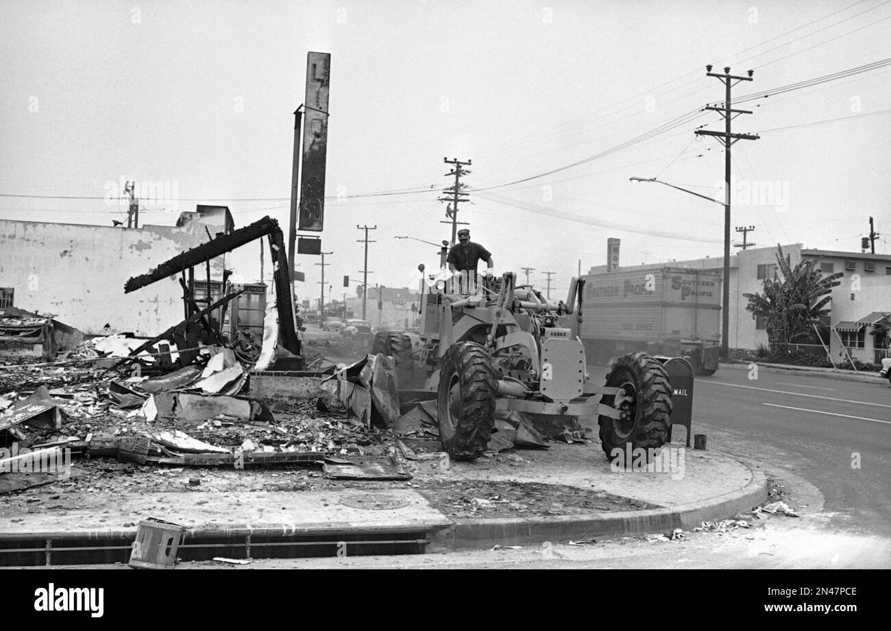 FILE - This Aug. 18, 1965 file photo shows a bulldozer clearing debris ...