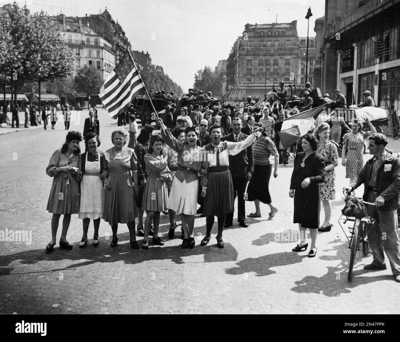 FILE, this Aug. 25, 1944 file photo shows French civilians with their ...