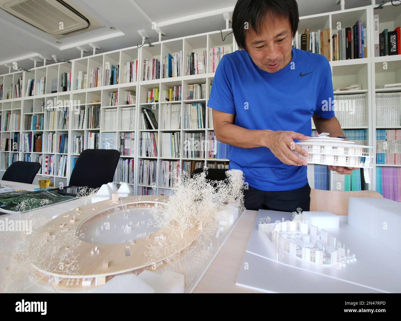 In this Tuesday, July 15, 2014 photo, architect Takaharu Tezuka shows ...