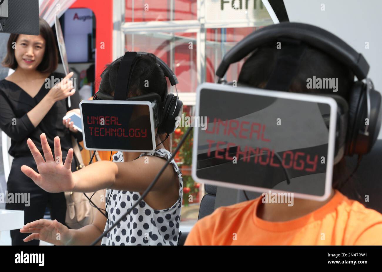 Children wearing the Oculus Rift virtual reality headsets, experience ...