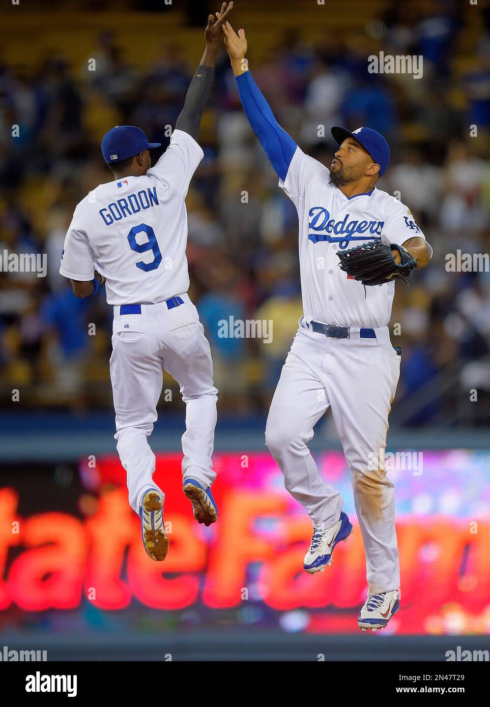 Los Angeles Dodgers' Dee Gordon, left, and Matt Kemp celebrate after ...
