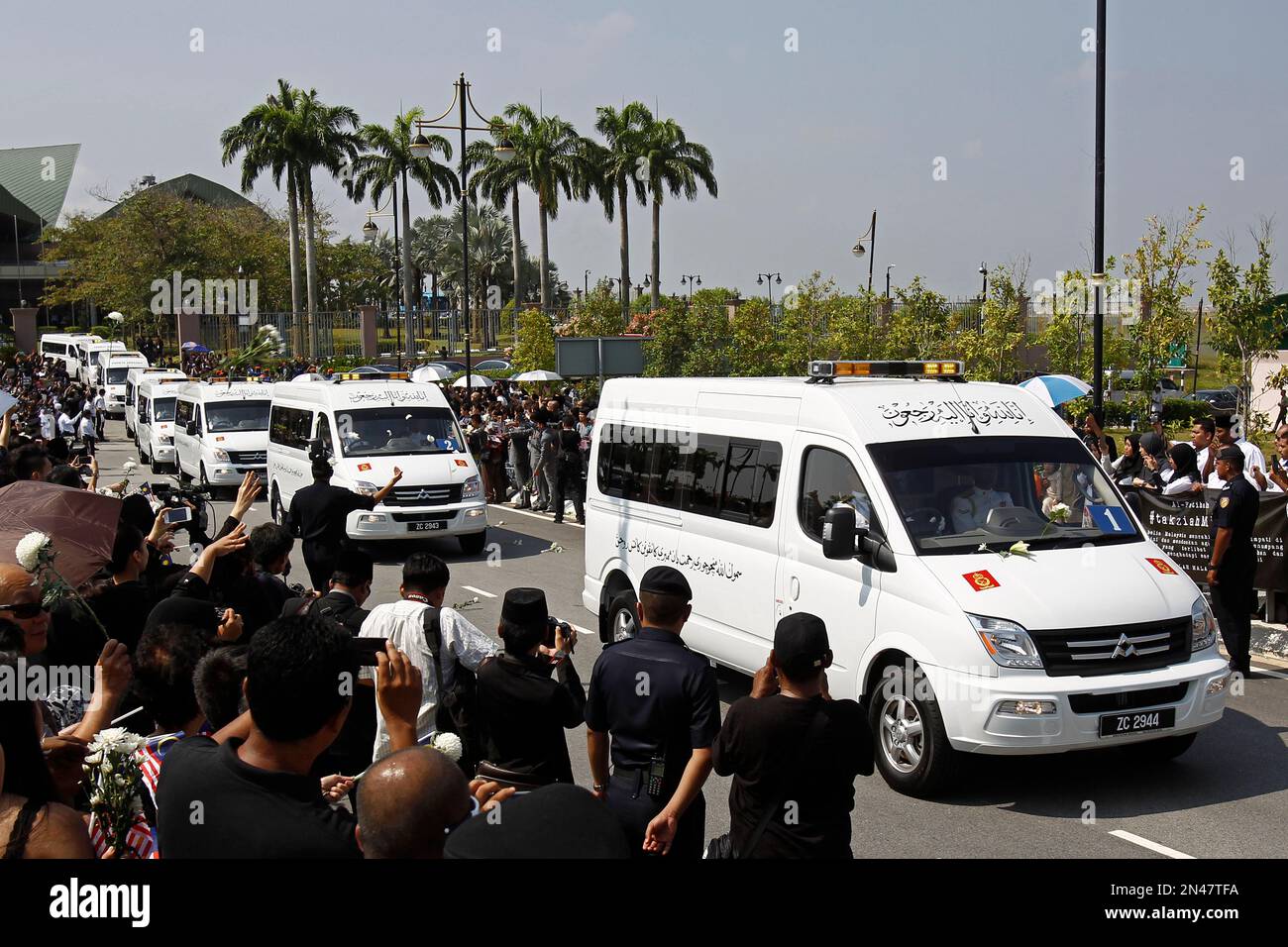 Hearses carrying victims' bodies of the ill-fated Malaysia Airlines ...