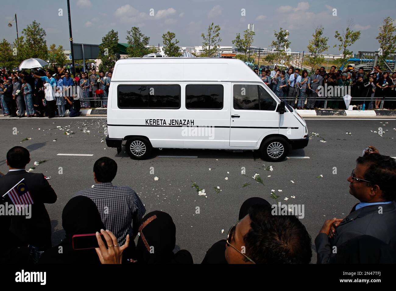 A hearse carrying a victim's body of the ill-fated Malaysia Airlines ...