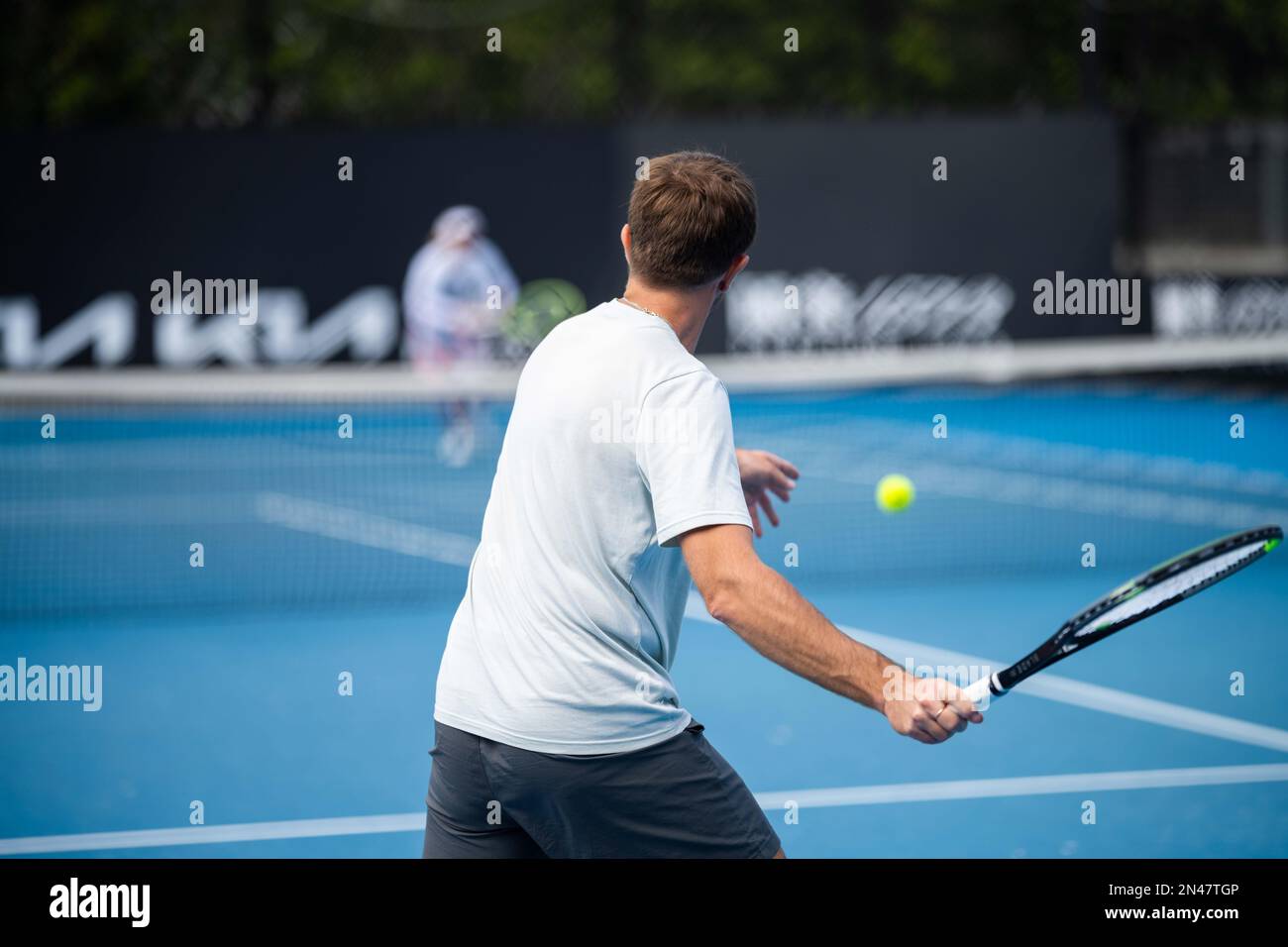 Beautiful female athlete playing tennis. Amateur female tennis player ...