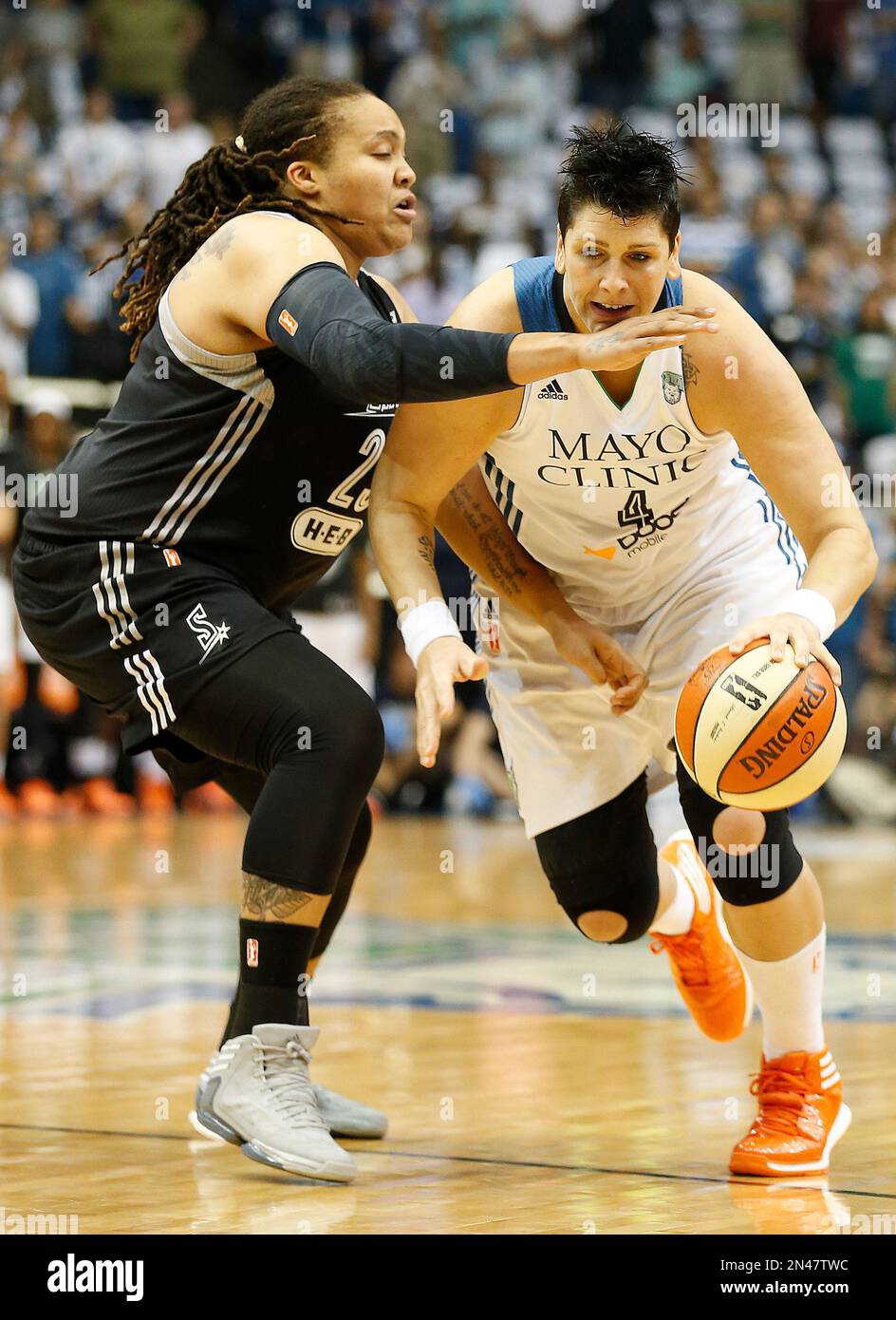 Minnesota Lynx center Janel McCarville (4) dribbles the ball around San ...