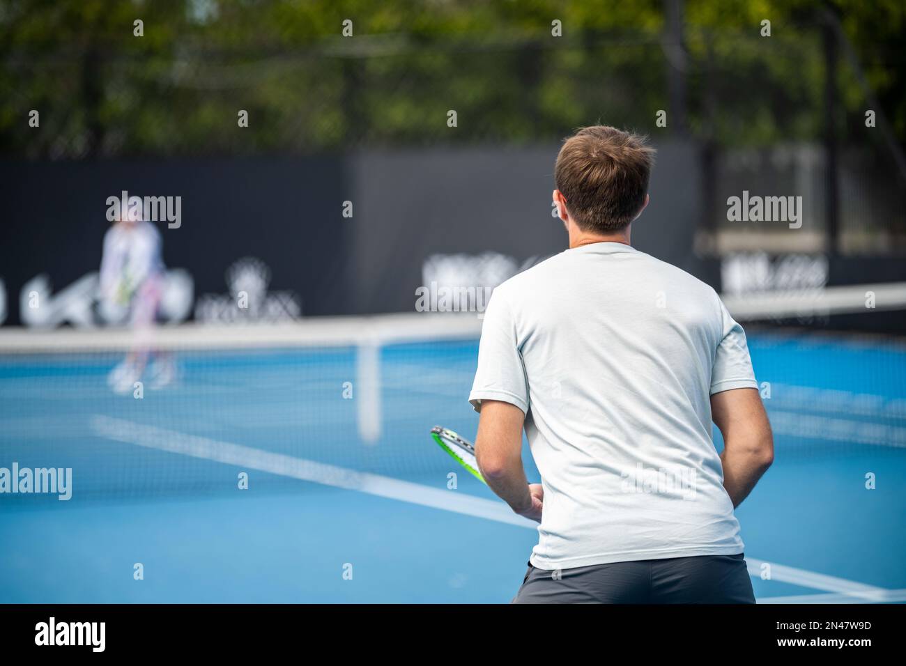 female Professional athlete Tennis player playing on a court in a ...