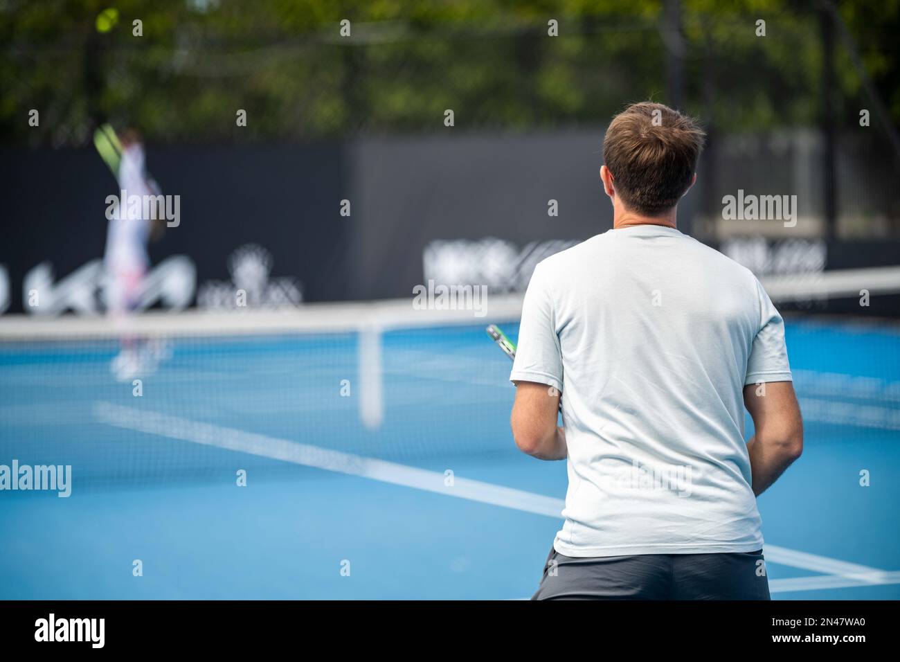Beautiful female athlete playing tennis. Amateur female tennis player ...