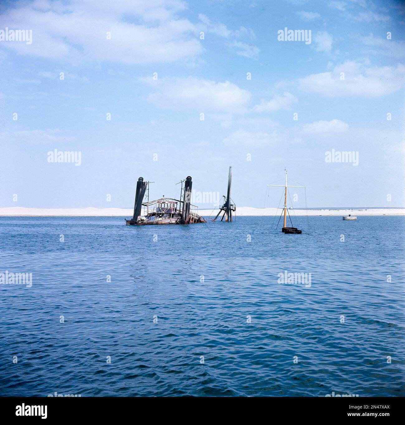 A sunken ship blocks the Suez Canal during the Arab-Israeli war, June ...