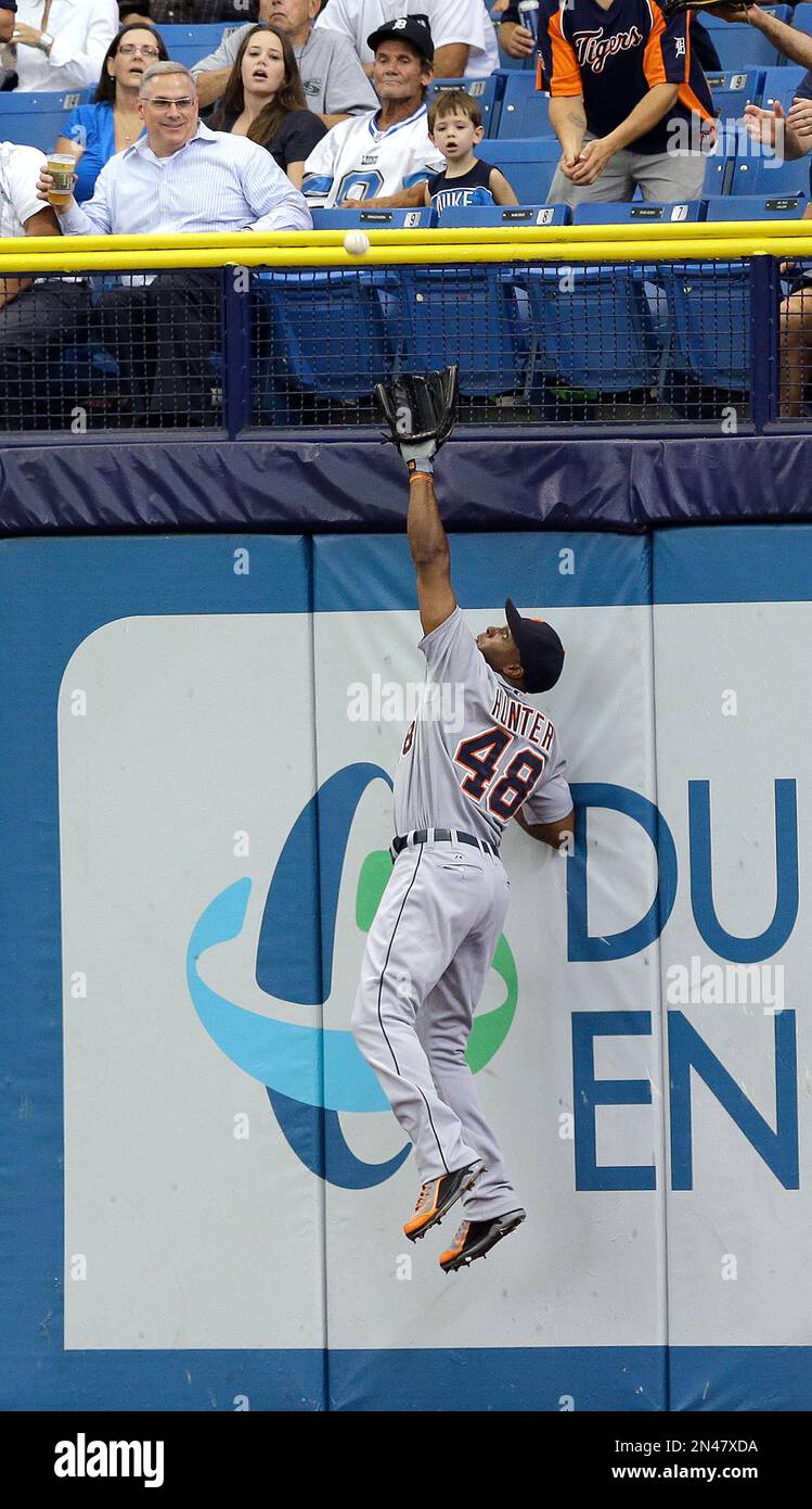Detroit Tigers right fielder Torii Hunter makes a leaping catch on a ...