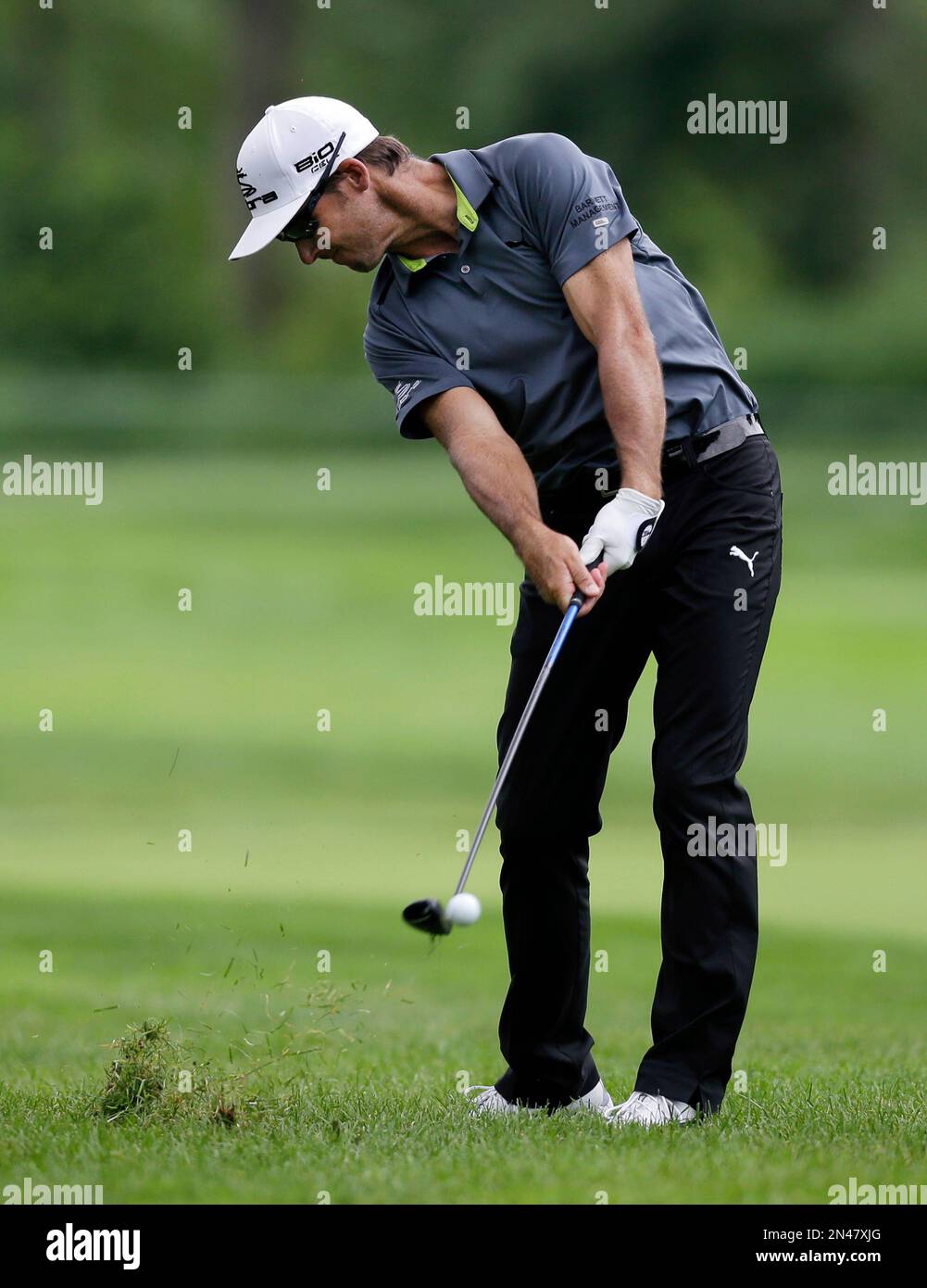 Will MacKenzie hits a fairway shot on the 18th hole during the first ...