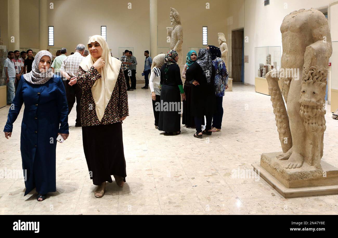 People visit the Iraqi National Museum after two halls were renovated ...