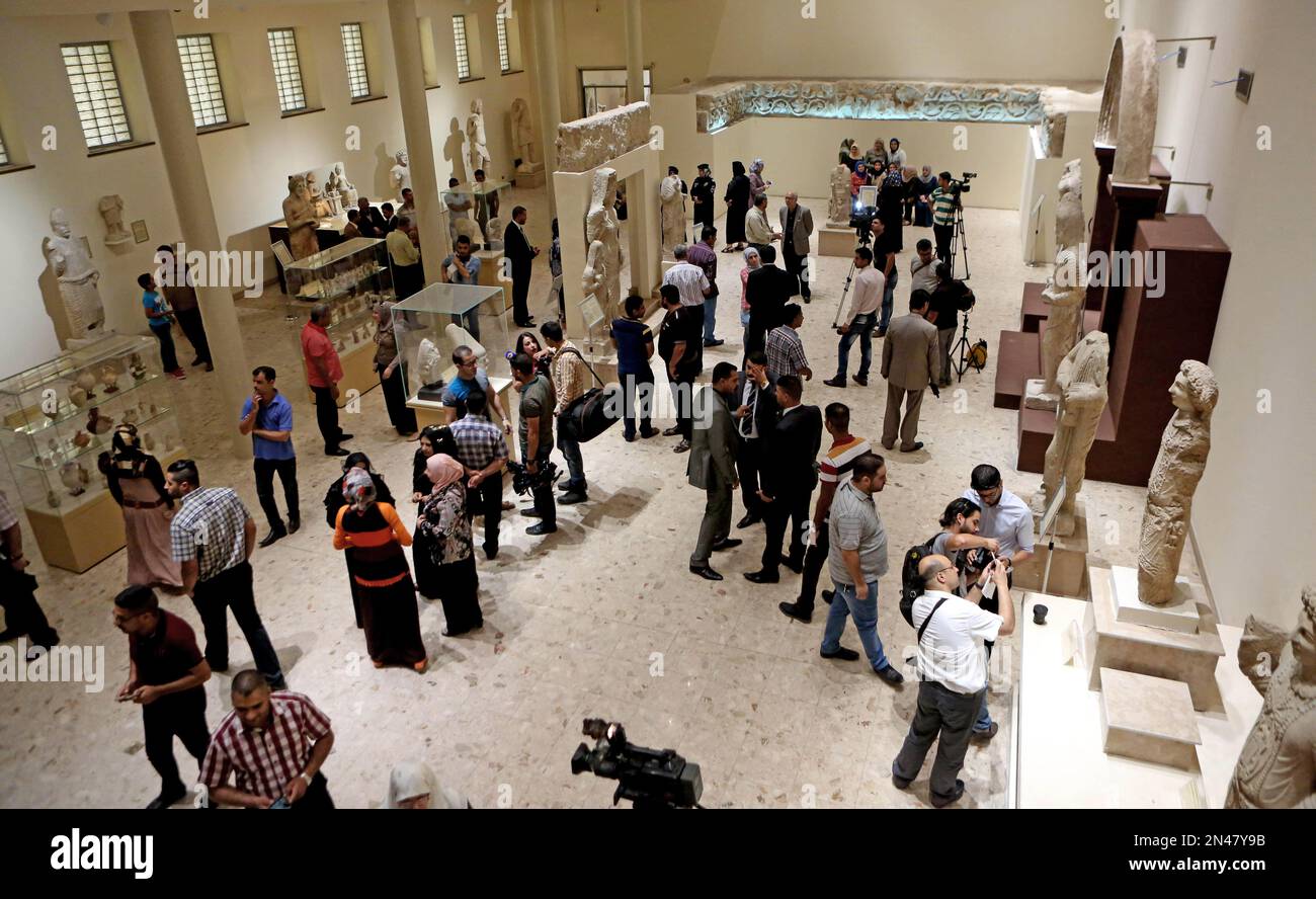 Stone figures depicting the family of Sanatruq are showcased at the ...