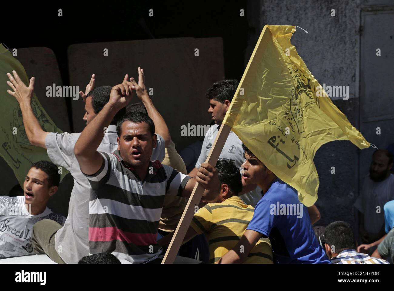 Palestinian relatives chant Islamic slogans during the funeral of Nasr ...