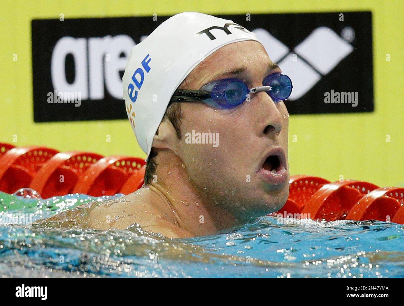 France's Fabien Gilot checks the score board after a men's 100m ...